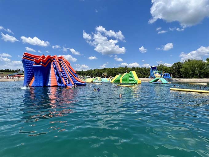A rainbow explosion of inflatable fun stretching across the lake &ndash; it's like someone dropped a box of crayons into the water and they grew to gigantic size.