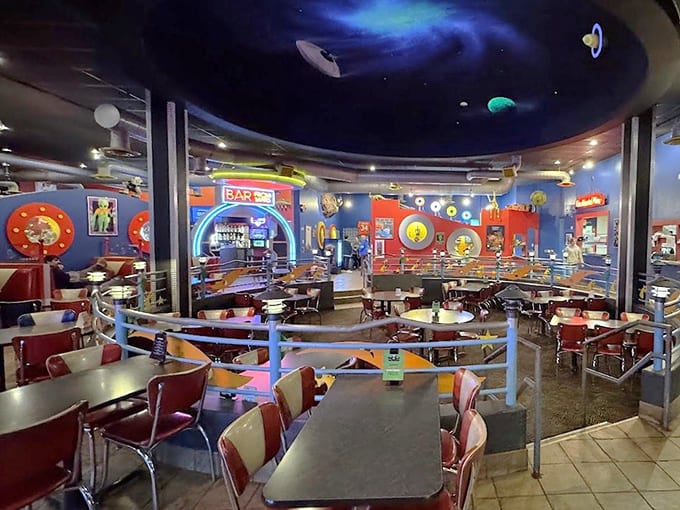 Step into a retro-futuristic wonderland where cosmic ceiling murals meet red vinyl booths &ndash; it's like dining inside a 1950s sci-fi director's dream.