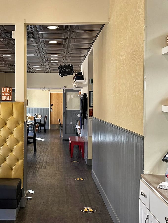 Golden tufted booths and warm wooden accents create an atmosphere that feels like the physical embodiment of butter melting on warm toast.