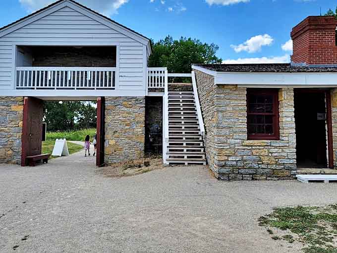 The Gatehouse welcomes visitors with its sturdy stone archway – your portal to stepping back two centuries in Minnesota history.