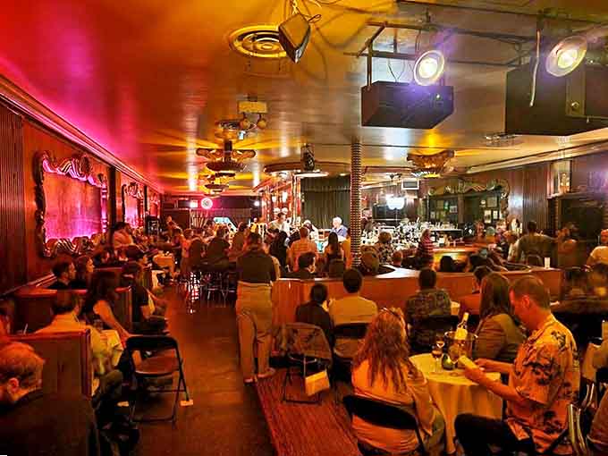 Inside, time stands still as patrons bask in amber light, the room humming with anticipation before the night's first notes.