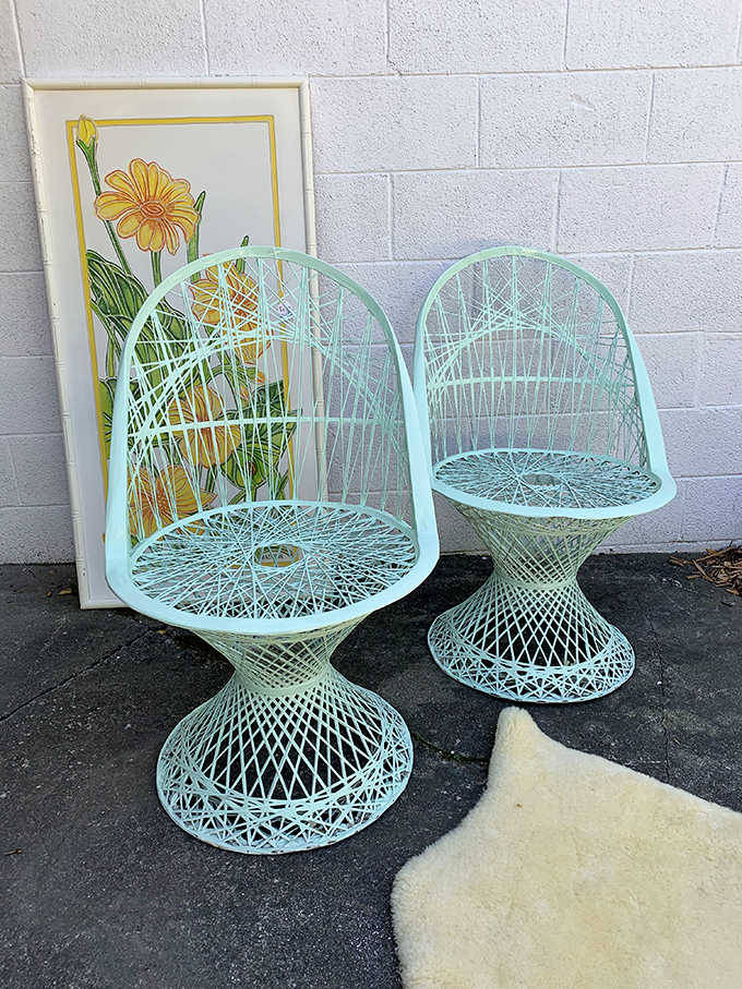 These mint-green peacock chairs are giving serious 1970s patio party vibes, and yes, they're just as comfortable as they are photogenic and conversation-starting.