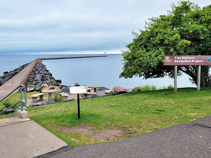 From shore, the breakwater stretches like a concrete invitation into the vast blue expanse, promising adventure and spectacular views.