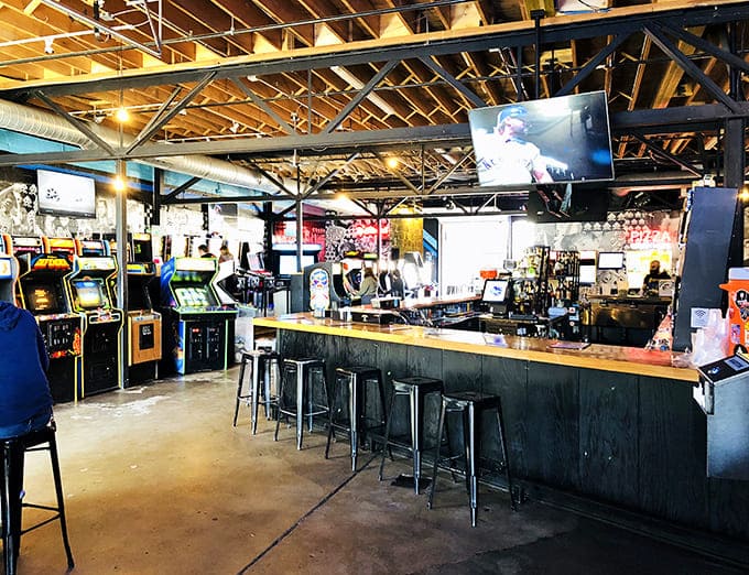 The heart of Up-Down's operation &ndash; industrial chic meets arcade paradise with exposed beams watching over rows of games and thirsty players.