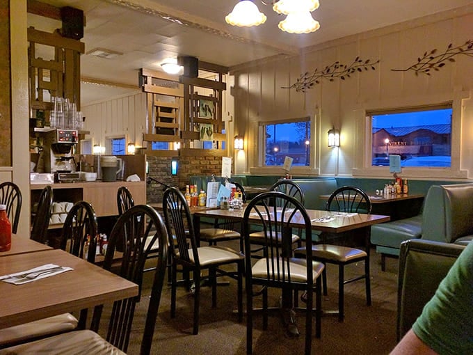 Mint-green booths and warm lighting create that perfect diner ambiance &ndash; not manufactured retro, but the real deal earned through decades.