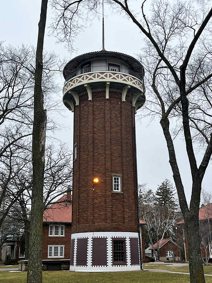 The historic water tower stands tall against the winter sky, its brick facade and white trim a testament to architectural beauty that's weathered a century of Minnesota seasons.