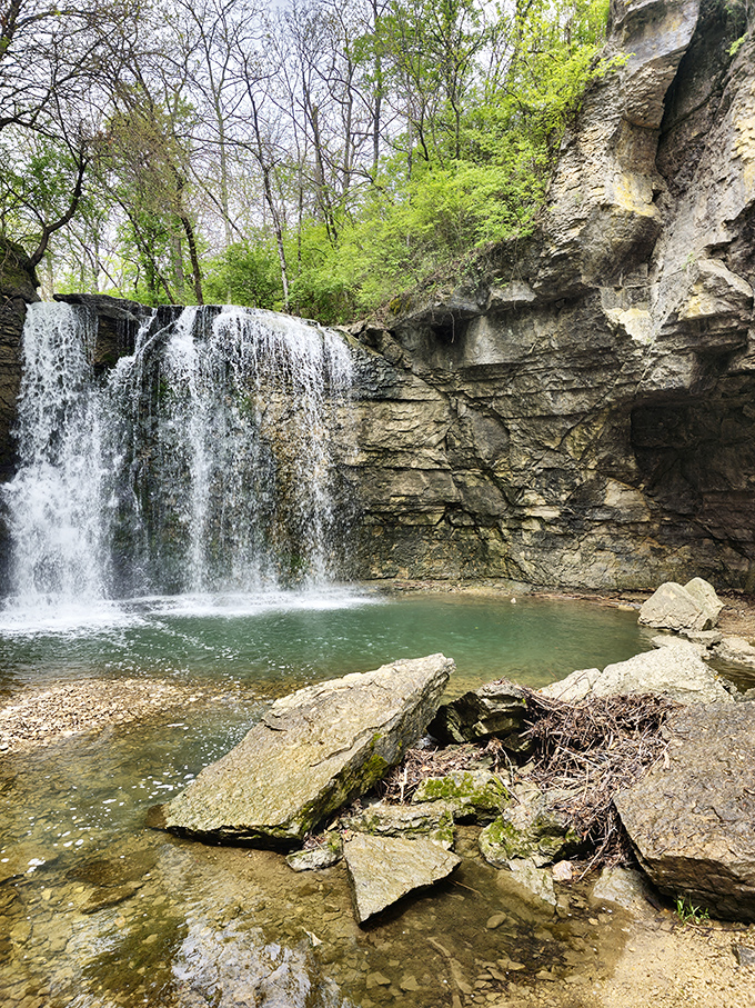 Nature's own symphony in motion – the waterfall's powerful cascade drowns out city noise, replacing it with primal, soothing rhythms.