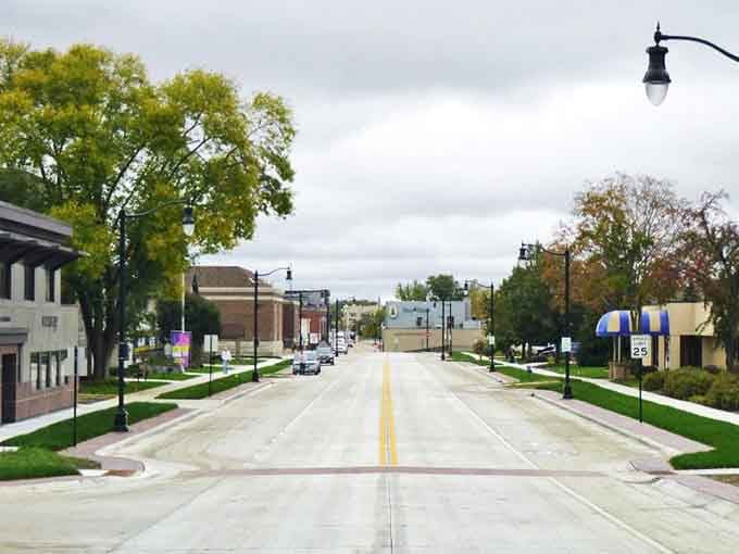 Downtown streets stretch wide and welcoming, lined with local businesses that remind you why main streets matter more than malls ever will.