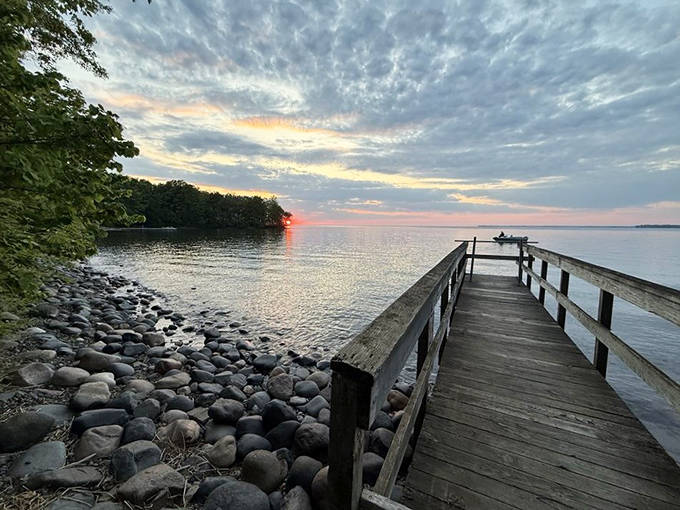 This wooden pier invites contemplation as the sun dips low, creating the perfect spot for sunset dreamers and fishing enthusiasts alike.