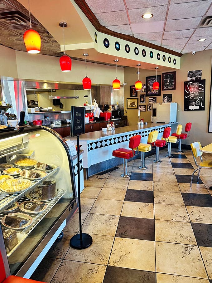 Interior: Step into a technicolor dream where cherry-red pendant lights hang over a checkerboard kingdom of nostalgia and mouthwatering possibilities.