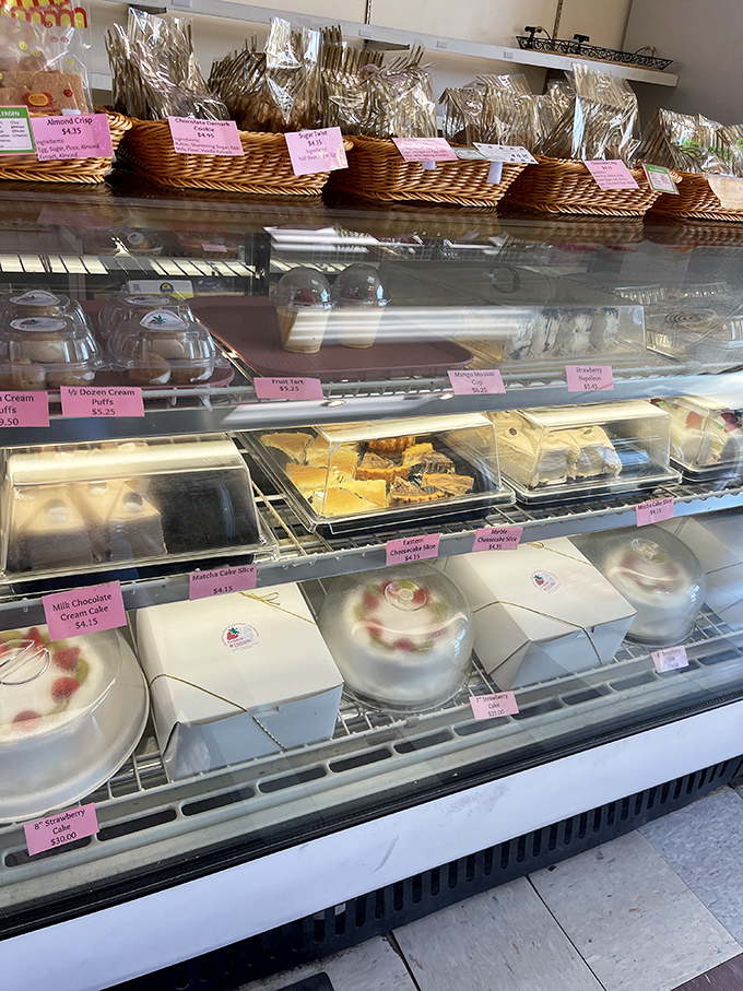 A peek into temptation &ndash; baskets of freshly baked goods line the top shelf while the display case below showcases an array of irresistible treats.