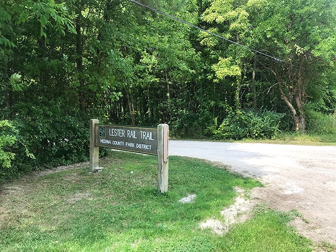 The welcoming entrance to Lester Rail Trail beckons visitors into a world where nature and nostalgia blend seamlessly.