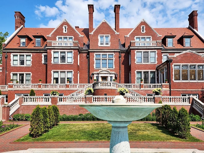 The mansion's imposing fa&ccedil;ade welcomes visitors with architectural swagger, its brick exterior and grand entrance promising stories of wealth and wonder within.