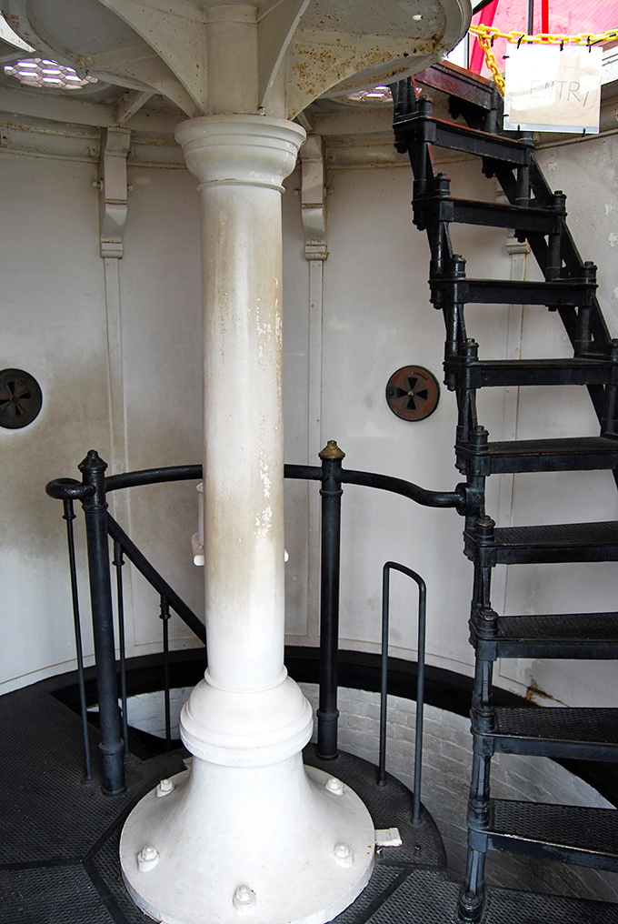 Inside the lighthouse, a central column anchors the spiral staircase &ndash; architectural poetry in white and black that's survived centuries.