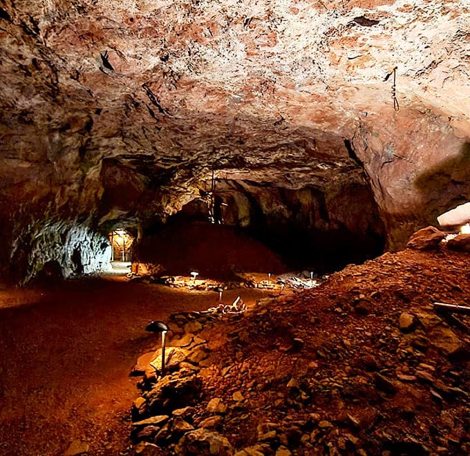 Nature's cathedral: Mineral-streaked walls create a mesmerizing underground landscape, sculpted by both geological forces and human determination over centuries.