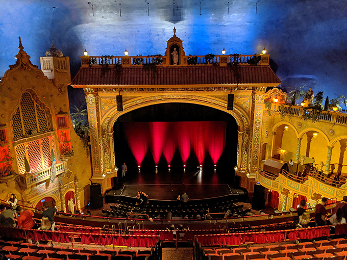 Step inside the Olympia's auditorium and find yourself transported to a Mediterranean courtyard under a starry night sky.