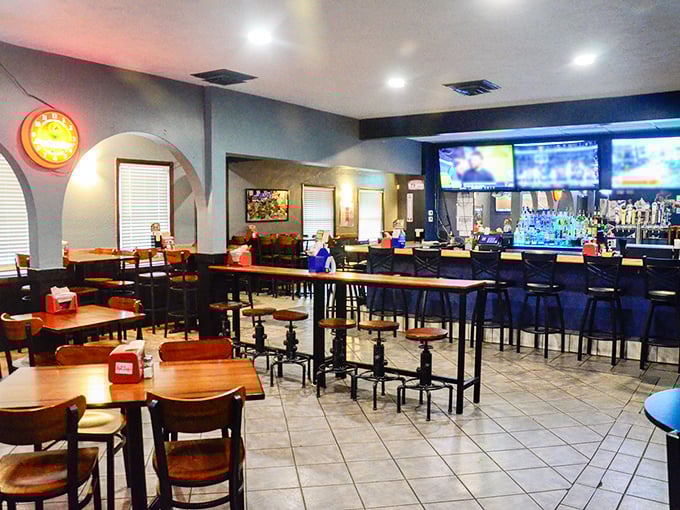 Warm wood tables, comfortable seating, and a welcoming bar create the perfect backdrop for game day gatherings or casual weeknight dinners.