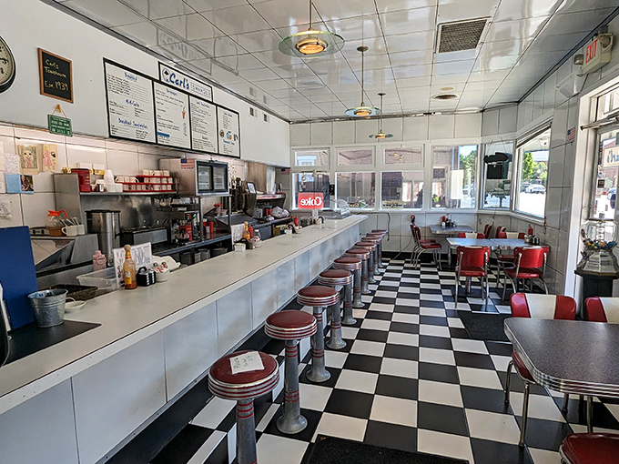 Classic diner perfection with its gleaming counter, red vinyl stools, and checkerboard floor &ndash; this isn't manufactured nostalgia, it's the real deal that's welcomed generations.