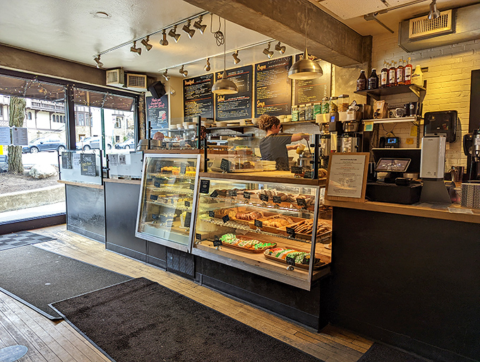 Behind the counter, culinary magic happens with quiet efficiency &ndash; the display case a treasure chest of carbs worth every guilty smile.