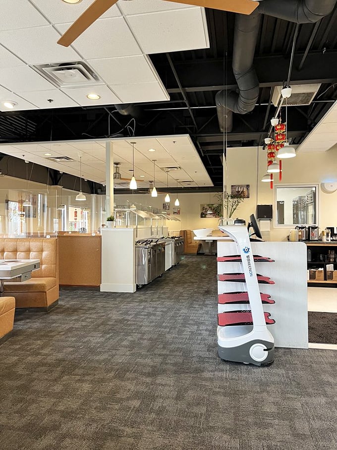 Inside Mala HotPot, sleek modern design meets traditional dining concepts. Spot the robot server waiting patiently to deliver its next culinary cargo!