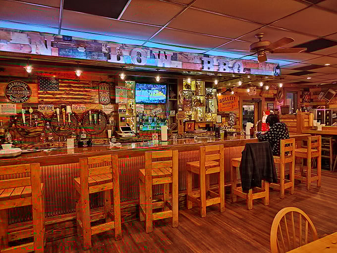 The bar area glows with warm wood and blue accent lighting &ndash; a perfect spot to contemplate life's big questions, like "How soon is too soon for a second helping?"