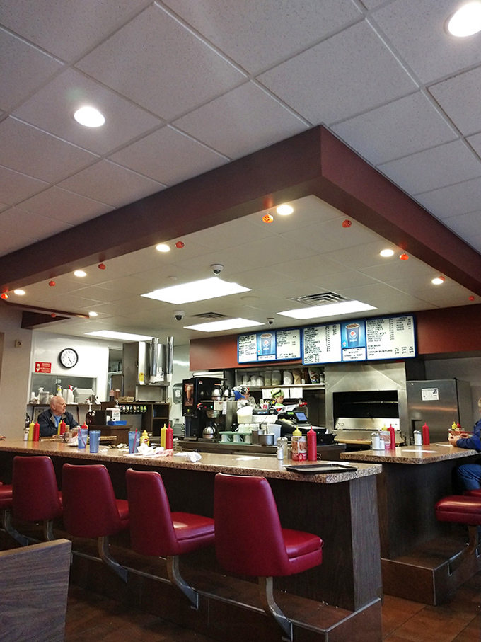 Red vinyl stools and a lunch counter create the perfect stage for burger bliss. This isn't retro by design&mdash;it's authentic by persistence.