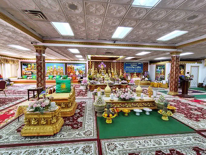 Step inside and the world transforms—ornate altars, golden Buddhas, and vibrant offerings create a sensory experience that belies the temple's Midwestern location.