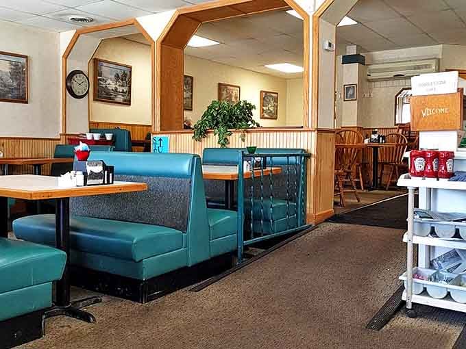Classic teal vinyl booths and wood-paneled walls create that perfect nostalgic diner atmosphere where comfort food tastes even better.