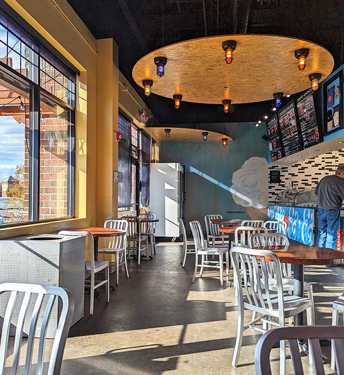 Modern yet cozy interior where circular light fixtures cast a warm glow over conversations and ice cream revelations.