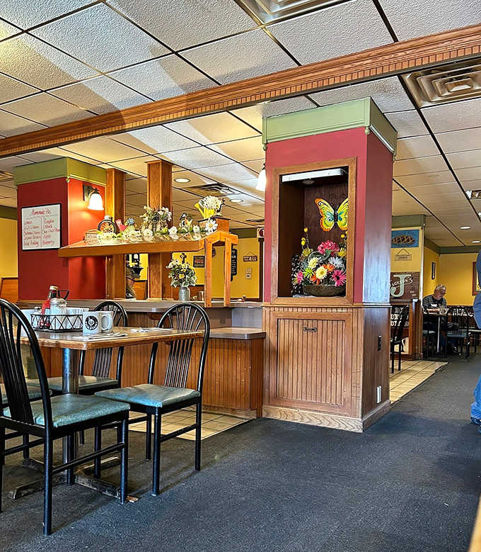 Warm yellow walls and wooden accents create that "grandma's kitchen" vibe where calories don't count and everyone feels like a regular.