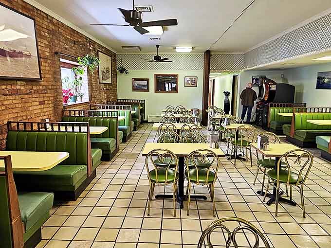 Wood-paneled walls adorned with movie memorabilia create a cozy atmosphere where film buffs can feast their eyes while satisfying their appetites.