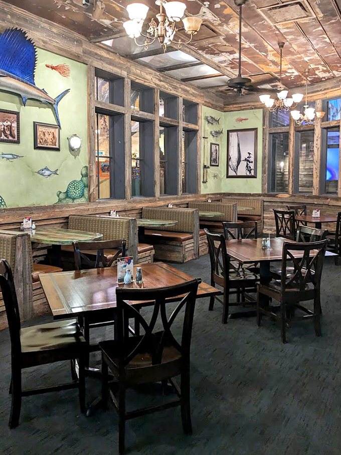 Step inside this underwater fantasy where weathered wood and sea-green walls transport diners to a submerged shipwreck dining experience.