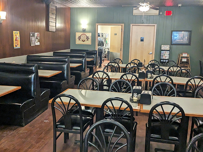 Black vinyl booths and sunburst chairs create a nostalgic dining room where conversations flow as freely as the cold beer.