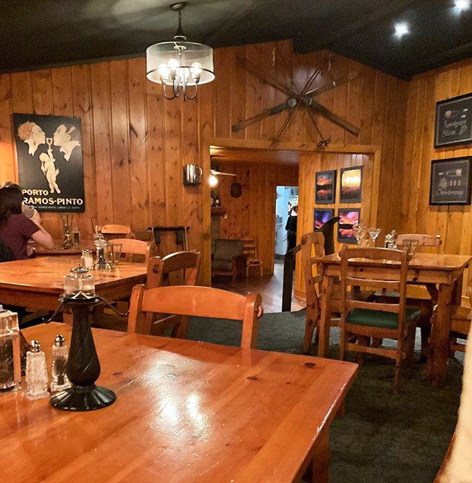 Knotty pine walls and vintage charm create the perfect backdrop for memorable meals &ndash; like stepping into a cozy cabin where food becomes celebration.