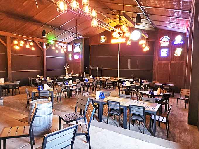 Rustic charm meets barbecue heaven inside, where wooden beams, Edison bulbs, and simple tables set the stage for serious meat appreciation.