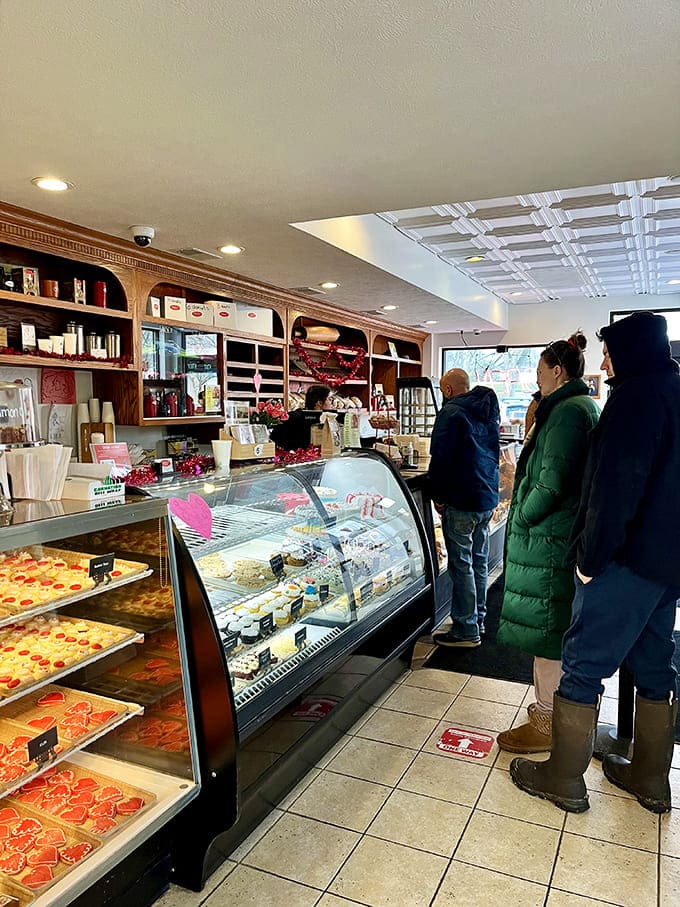 The display case gleams like a jewelry store, except instead of diamonds you get something way more valuable: fresh donuts and the promise of a really good morning ahead.