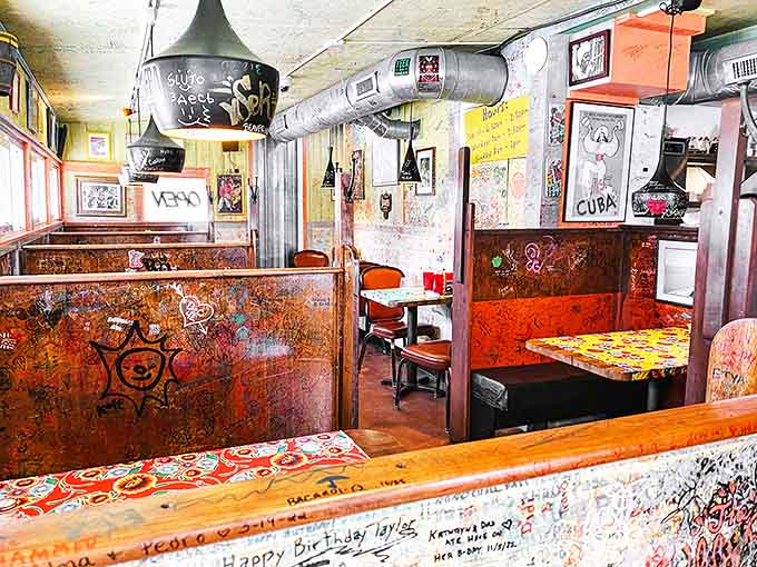 Step inside to a world where every inch tells a story &ndash; wooden booths covered in decades of diner graffiti create an atmosphere as rich as the menu.