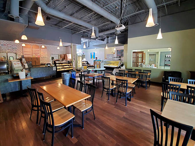 The spacious interior balances modern coffee shop vibes with neighborhood bakery warmth &ndash; those pendant lights somehow make everything look more delicious.