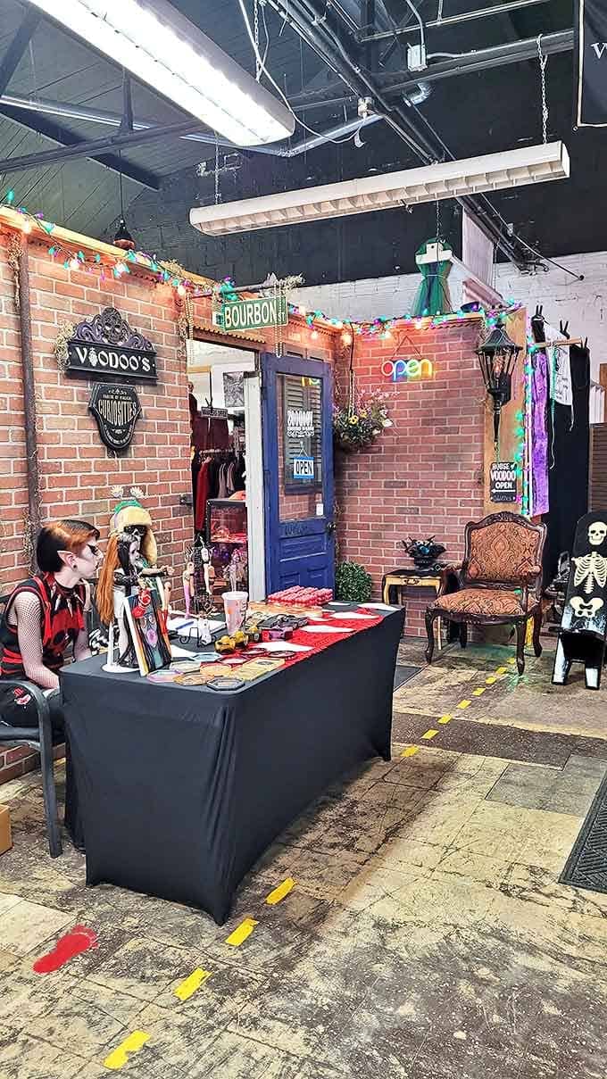 Colorful string lights cast an otherworldly glow across brick walls, creating the perfect backdrop for browsing curiosities and contemplating mortality.
