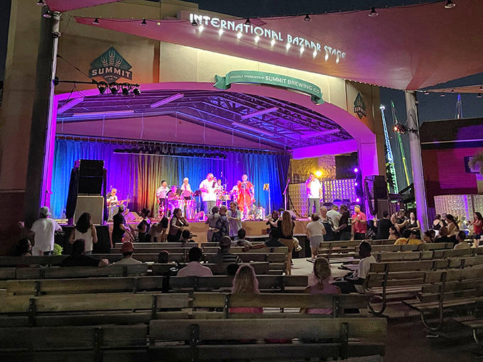 As twilight falls, the International Bazaar stage lights up with performances that transform shopping trips into cultural journeys through music and movement.