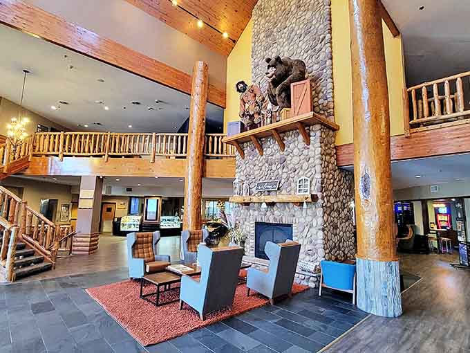 The lobby's towering stone fireplace and rustic timber beams create the perfect "mountain lodge meets water park" aesthetic that you never knew you needed.