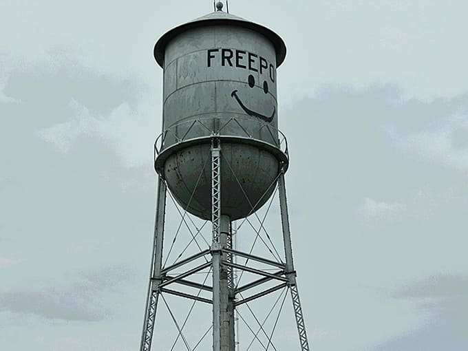 Looking up at Freeport's famous landmark, the tower's metal structure creates dramatic lines against the clouds while its smile beams down.