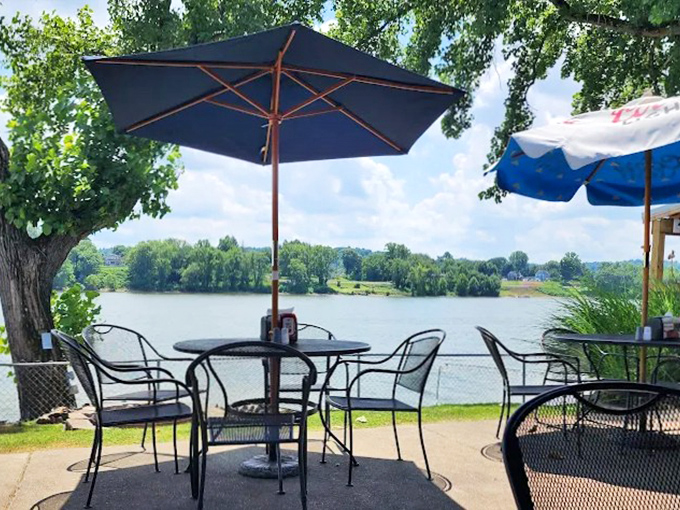 Riverside dining perfection: Where every table comes with a side of Ohio River views that somehow make the barbecue taste even better.