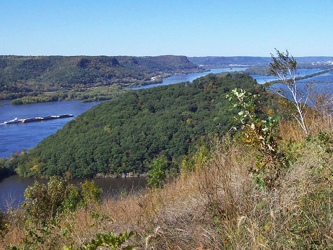 The mighty Mississippi unfolds before you, its waters telling stories of centuries past while bluffs stand guard like ancient sentinels.