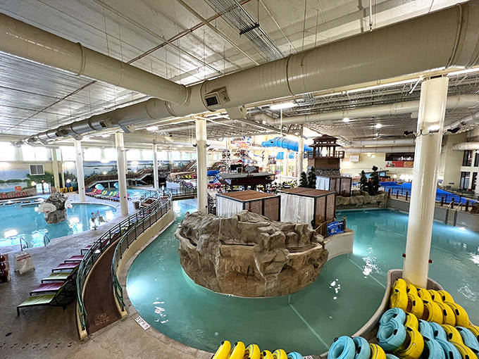 The indoor water park's central hub buzzes with activity as families navigate between pools, slides, and that suspiciously calm lazy river.