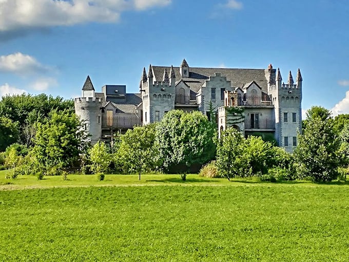 From across the meadow, the castle's silhouette creates a fairytale vision against the Midwestern sky, a medieval mirage amid rolling farmland.