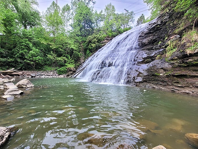 The waterfall's middle section reveals nature's patient artistry, carving channels through ancient shale and sandstone over countless centuries.