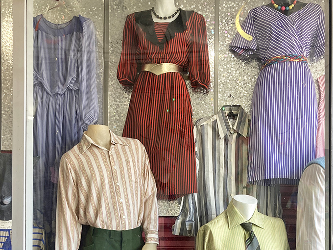 Mannequins display the shop's vintage treasures with silent dignity &ndash; each striped and patterned piece telling stories of fashion eras long gone but not forgotten.