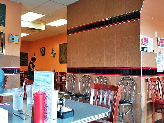 Inside, warm orange walls and simple furnishings create the perfect backdrop for the flavor explosion that's about to hit your table.