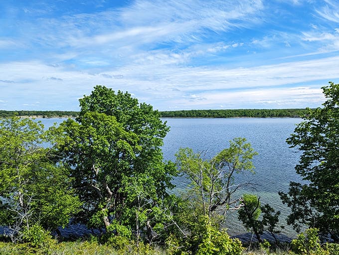 The vast expanse of Glendalough's lake mirrors the sky perfectly, creating that rare optical illusion where heaven and earth become indistinguishable.